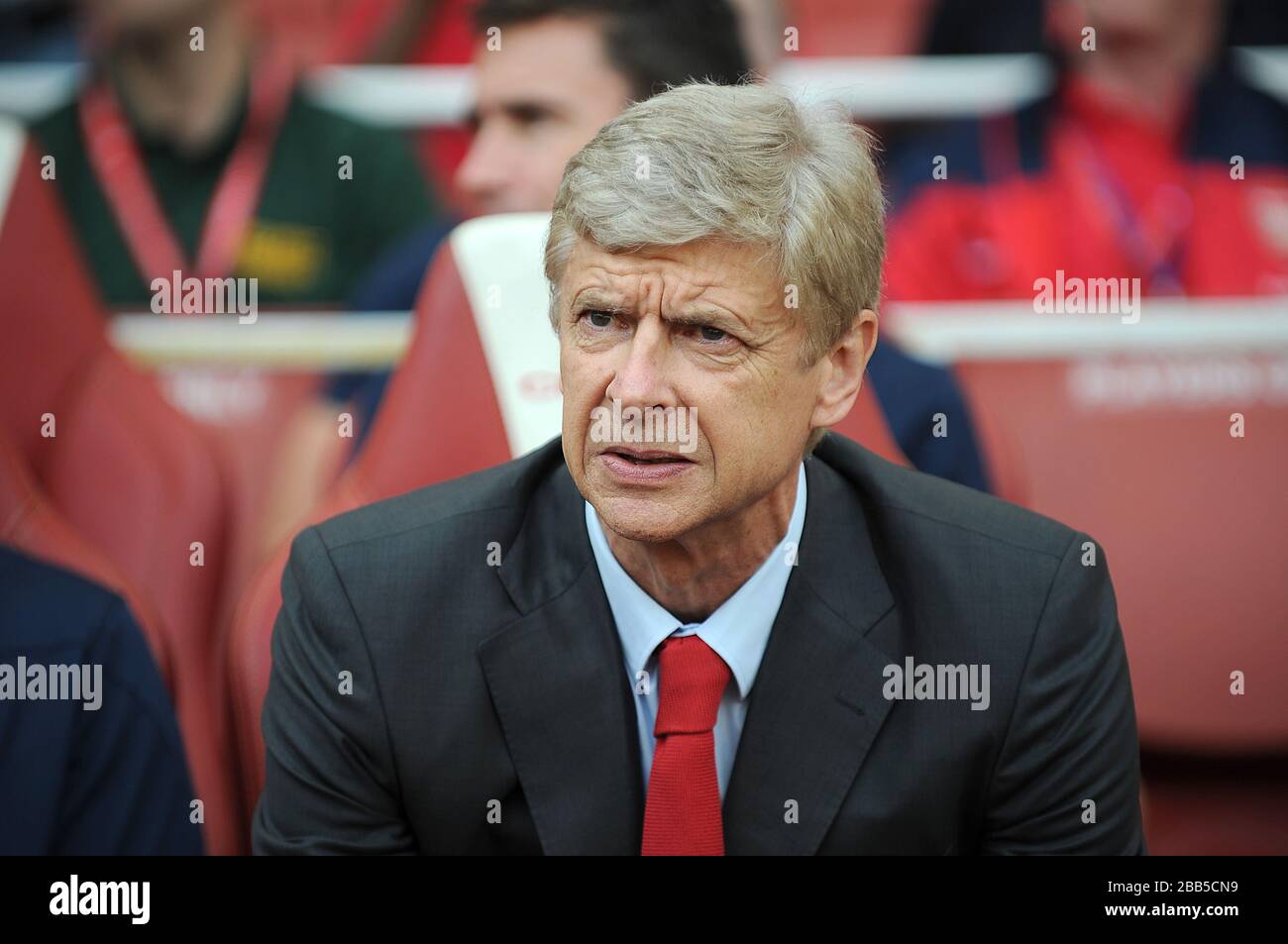 Arsenal manager Arsene Wenger in the dugout before kick-off Stock Photo ...