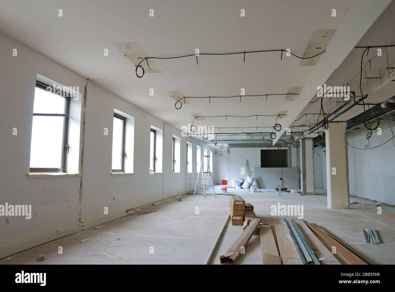 Improvement construction work in huge white office Stock Photo - Alamy