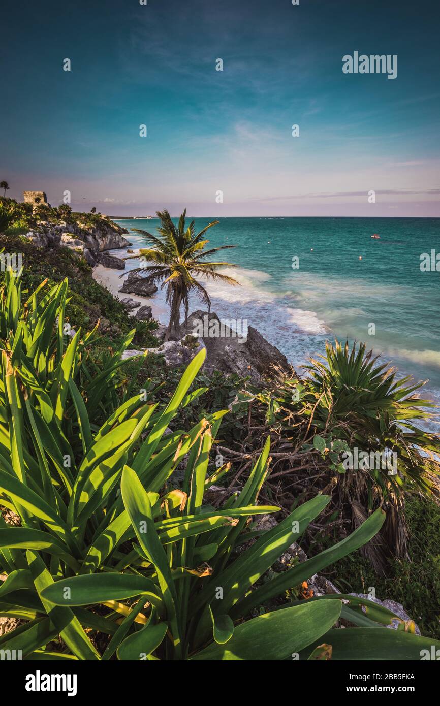 Sunset view at Mayan ruins of Tulum at tropical coast. El Castillo ...