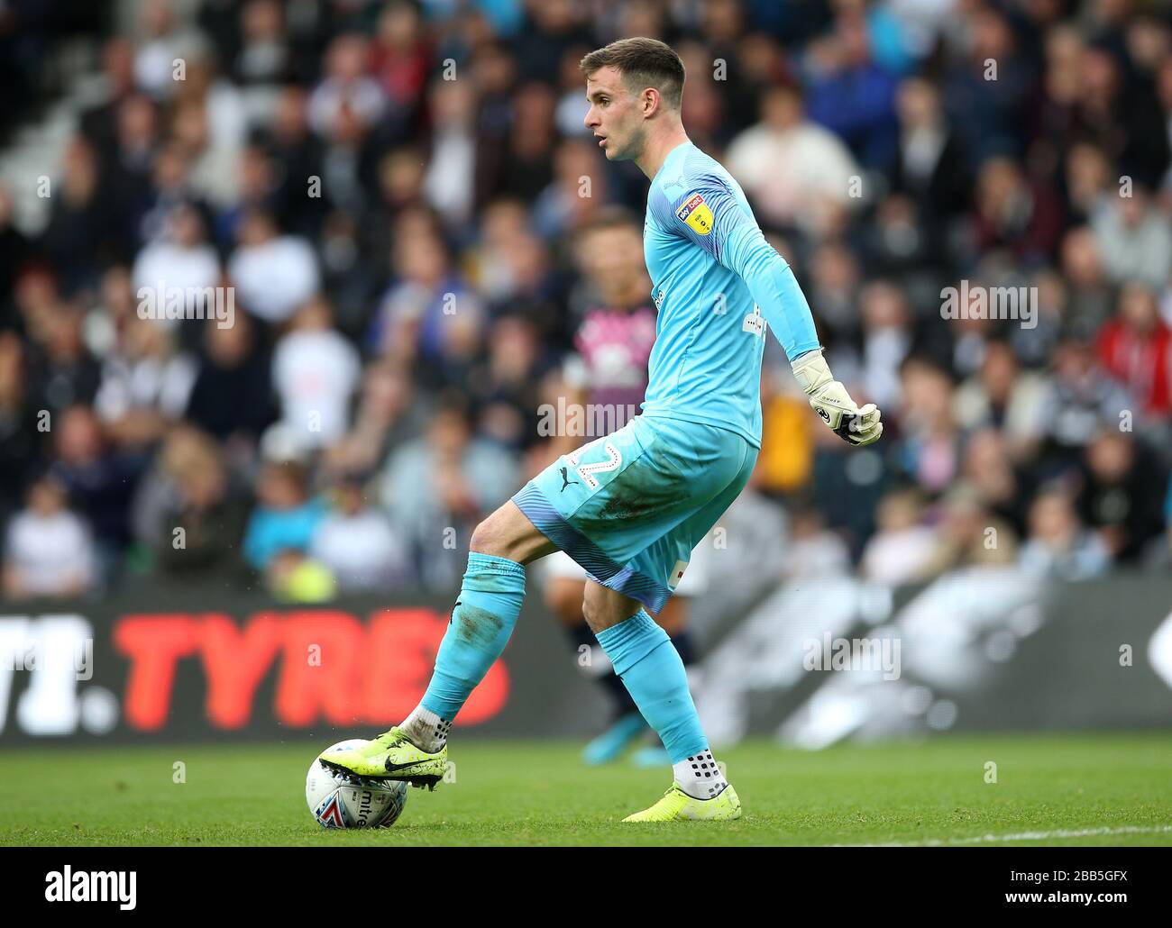 Luton Town goalkeeper Simon Sluga successfully controls a back pass ...