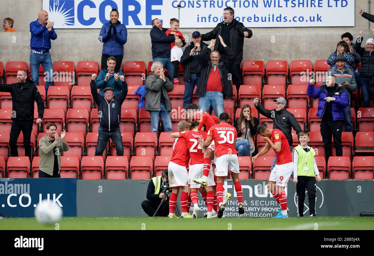 Swindon Town's Eoin Doyle (obscured) celebrates scoring his side's ...