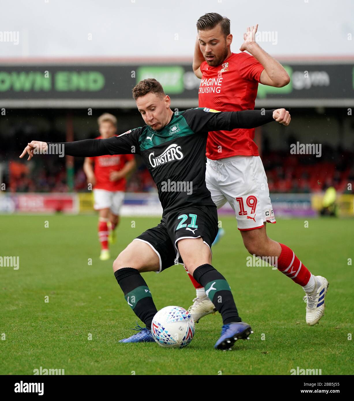 Swindon Town's Jordan Lyden (right) and Plymouth Argyle's Callum ...