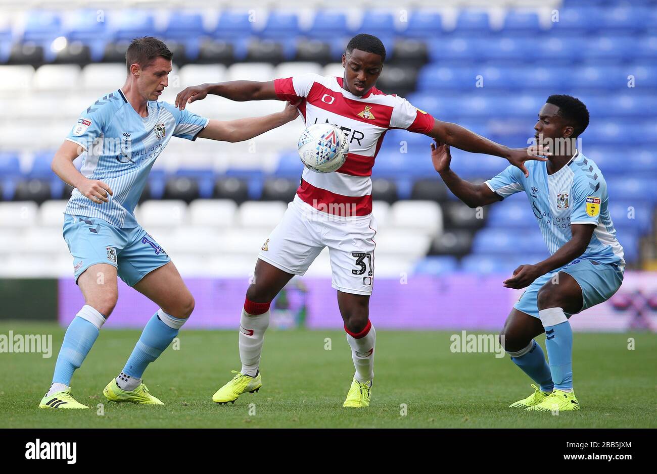 Coventry City's Luke Hyam and Brandon Mason battle for the ball with ...