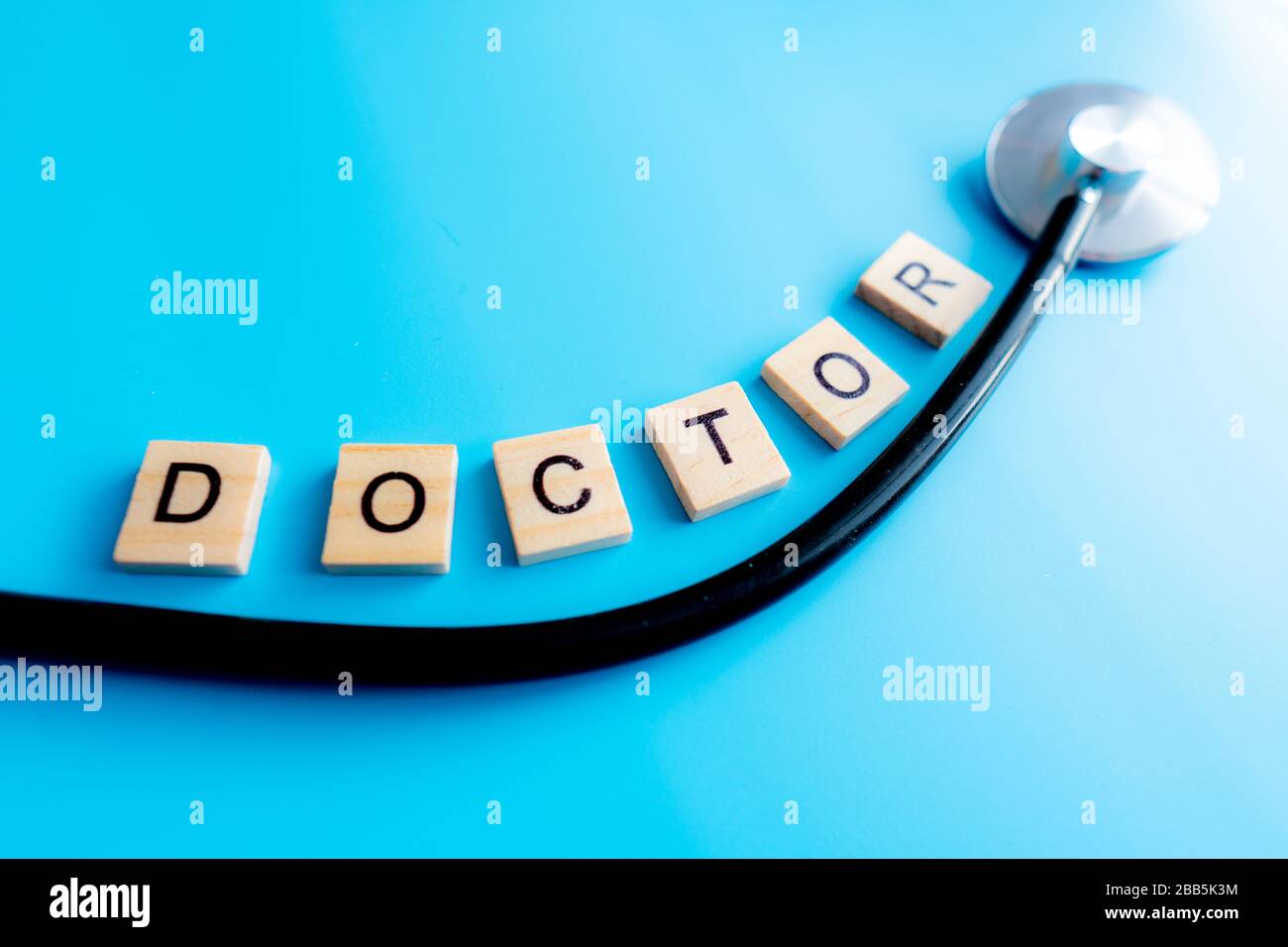 healthcare and medical concept - doctor wooden sign with stethoscope ...