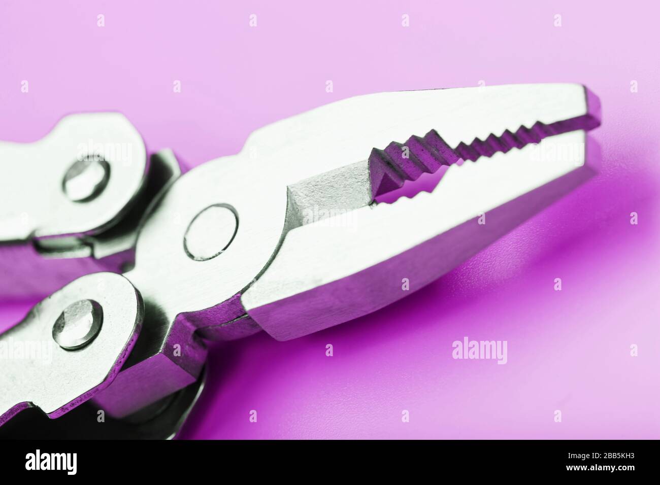 Multitool is a multi-functional tool on a pink background. The concept ...