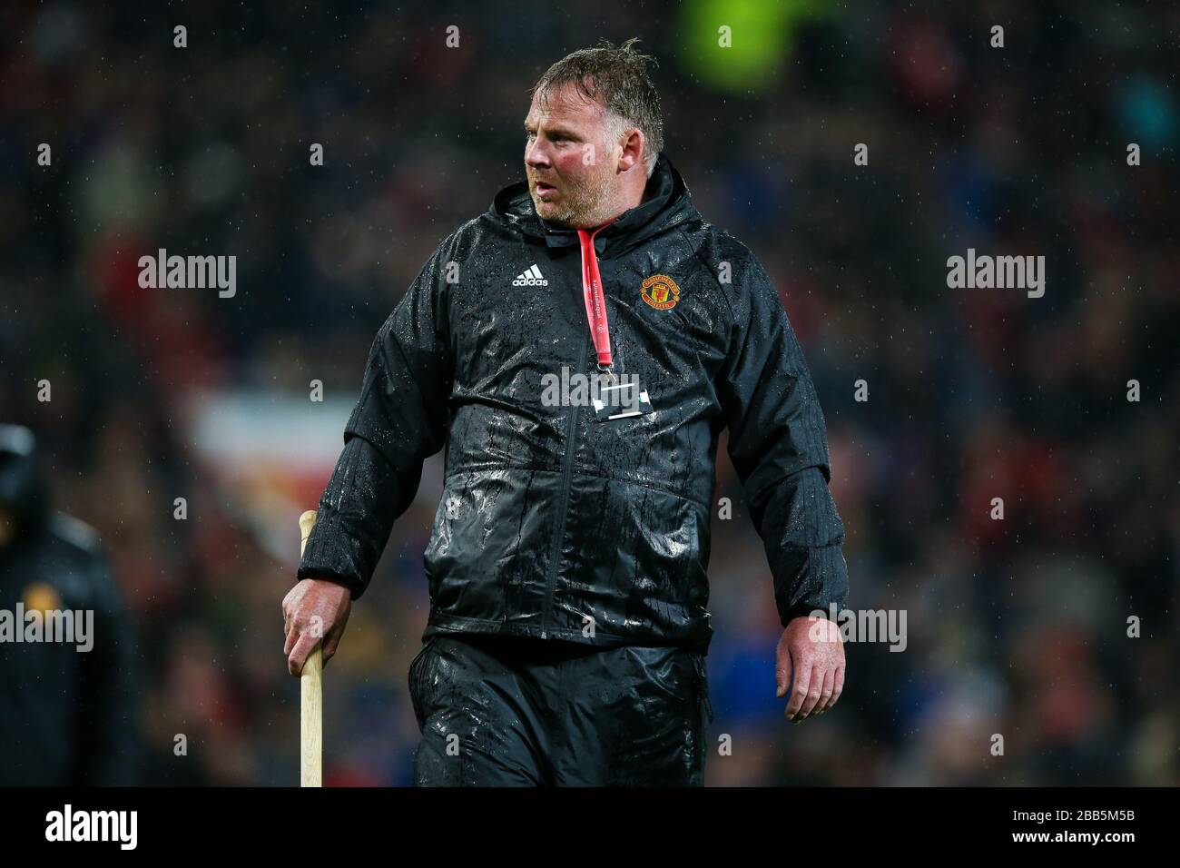 A Manchester United ground staff prepares the pitch before the Premier ...