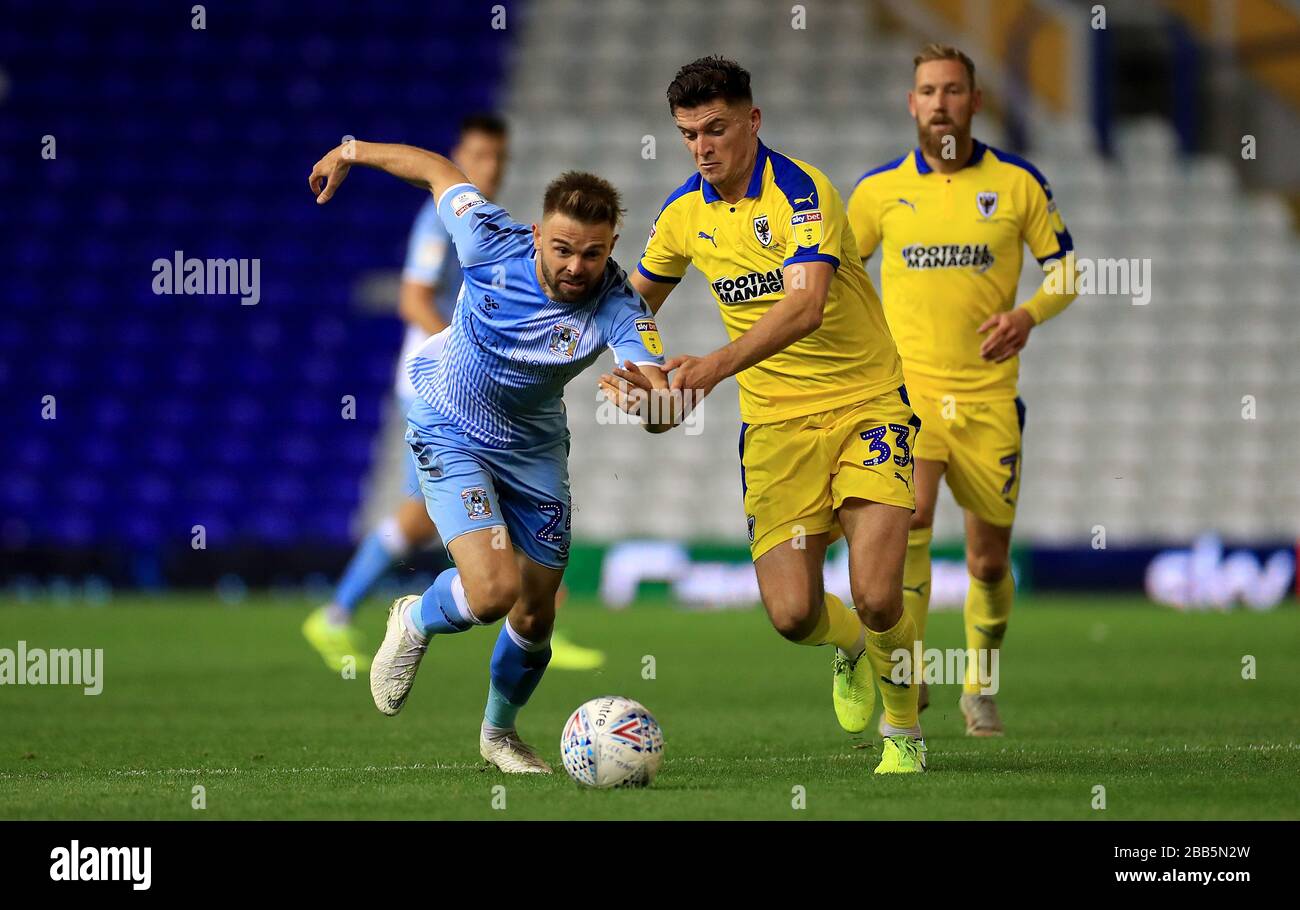 Coventry City's Matt Godden (left) and Wimbledon's Callum Reilly battle ...