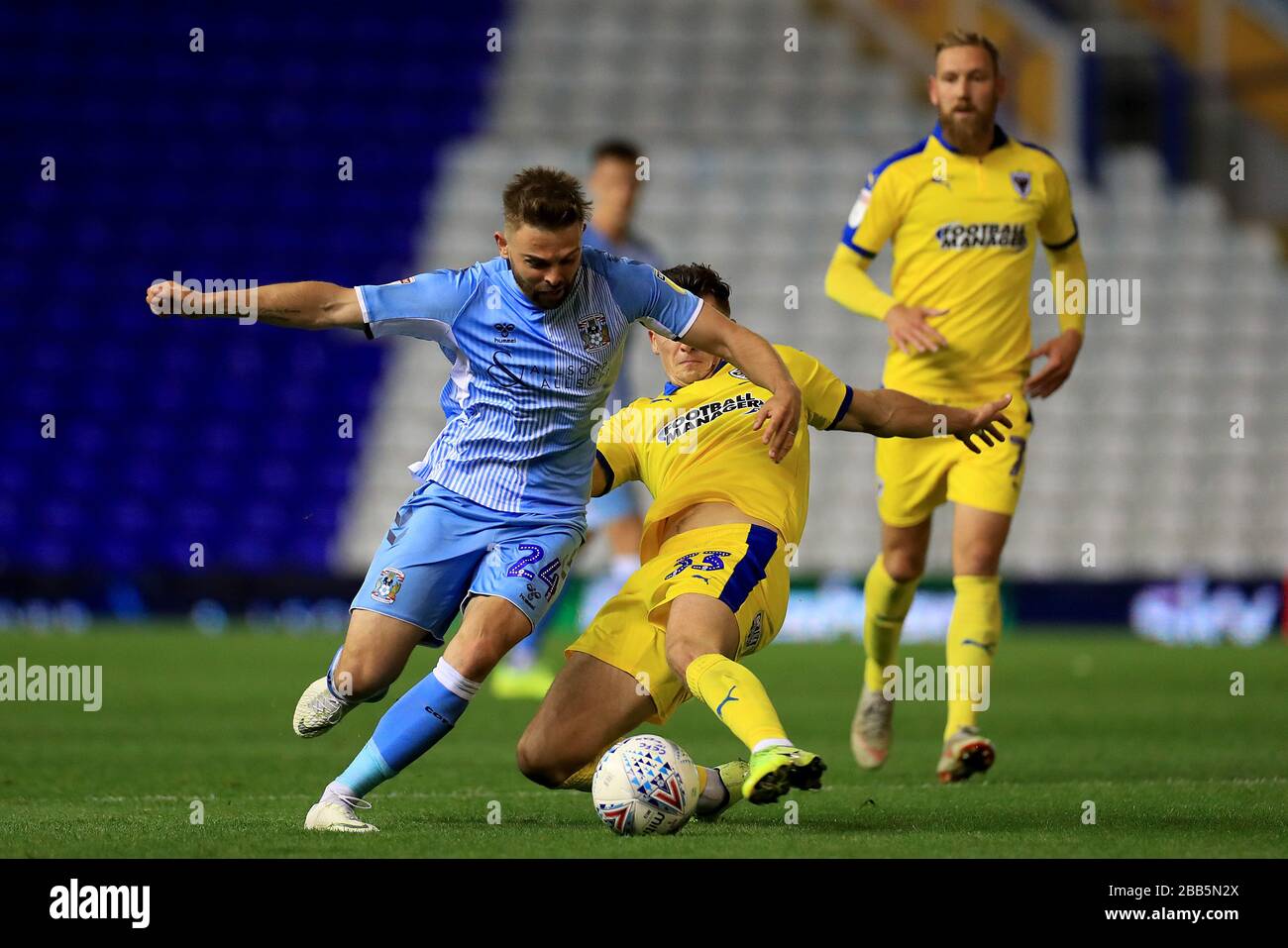 Coventry City's Matt Godden (left) and Wimbledon's Callum Reilly battle ...