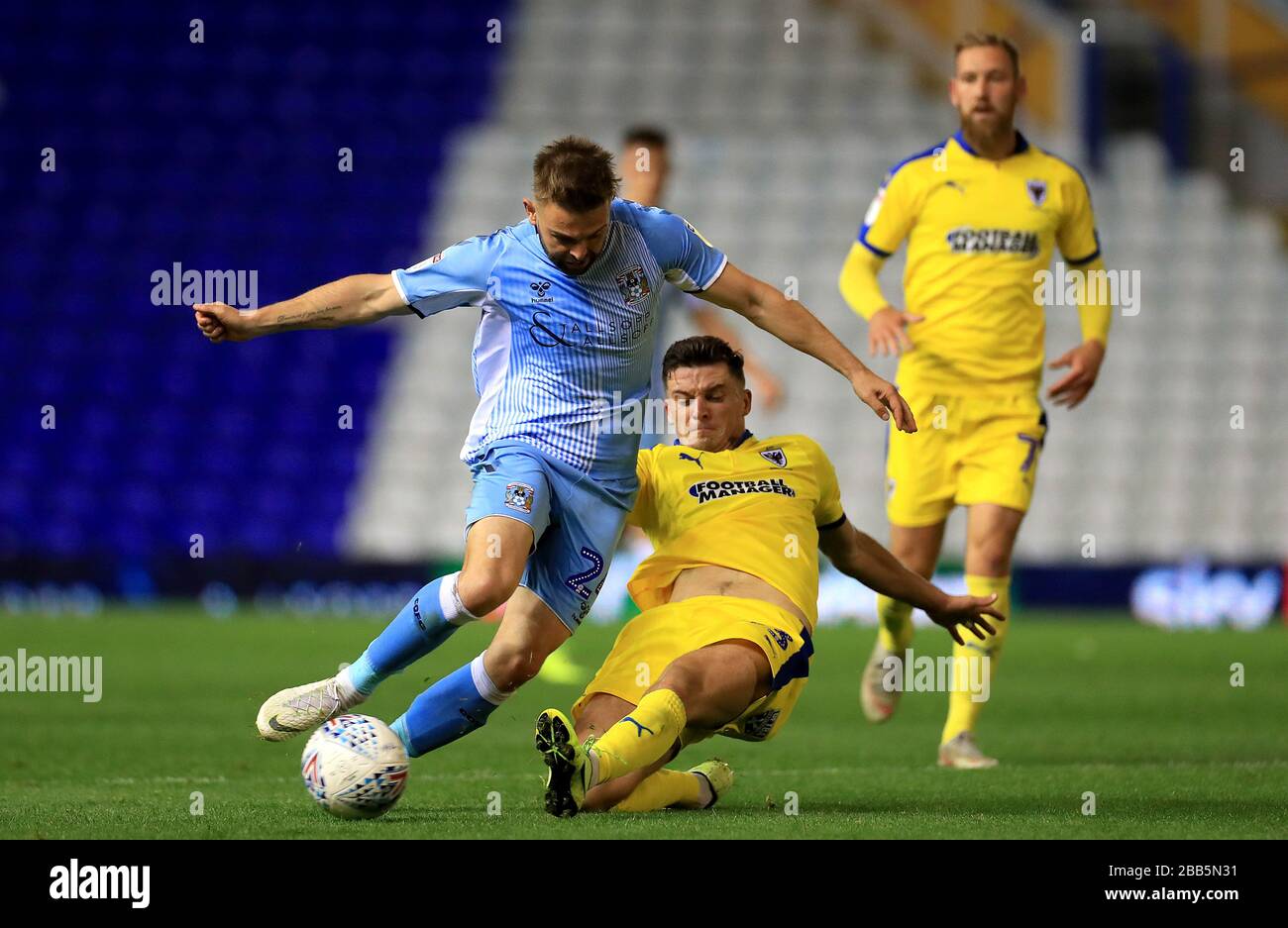Coventry City's Matt Godden (left) and Wimbledon's Callum Reilly battle ...