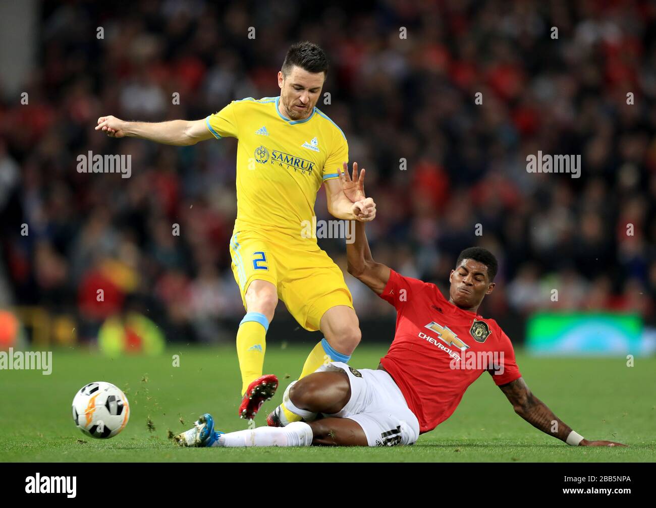 Astana's Antonio Rukavina (left) and Manchester United's Marcus ...