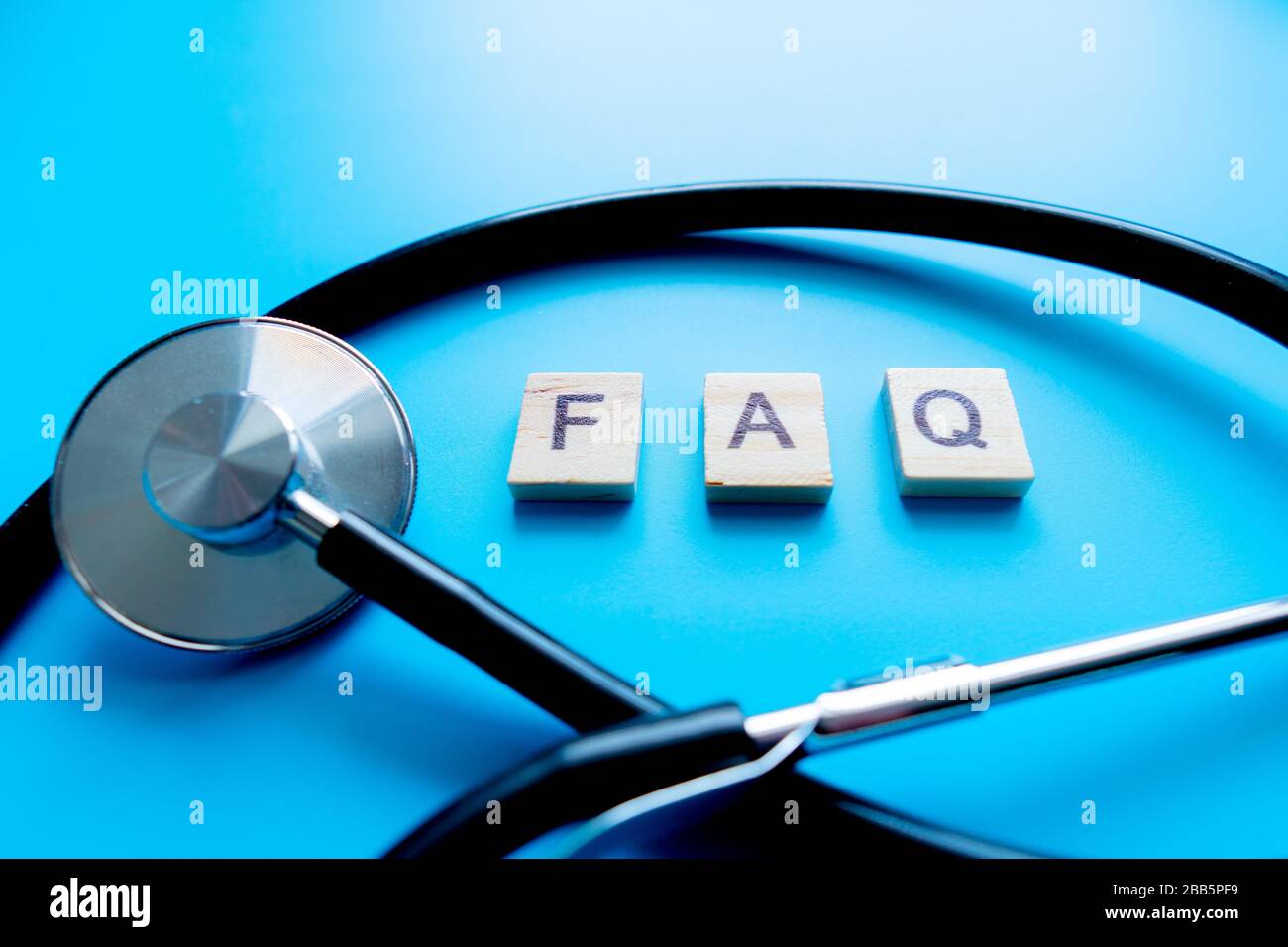 Wooden block form the word FAQ with stethoscope. Medical concept Stock ...