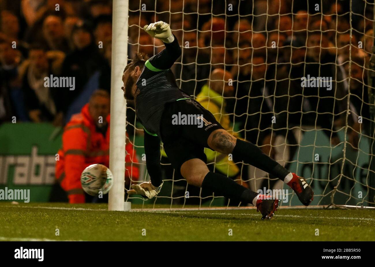 Colchester United's Dean Gerken saves a penalty from Tottenham Hotspur ...