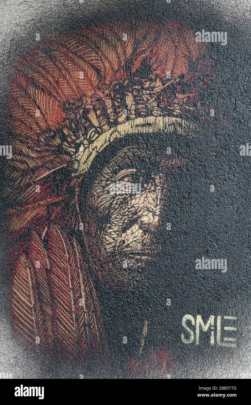 Graffiti street art portrait of a Native American Indian chief, in the ...
