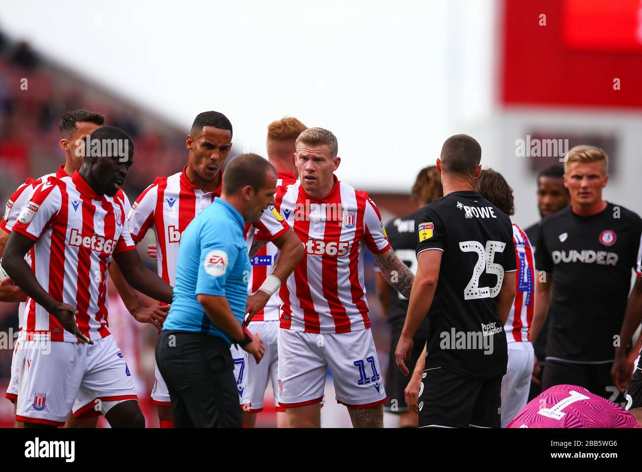 Stoke City's James McClean and other players surround referee Geoff ...