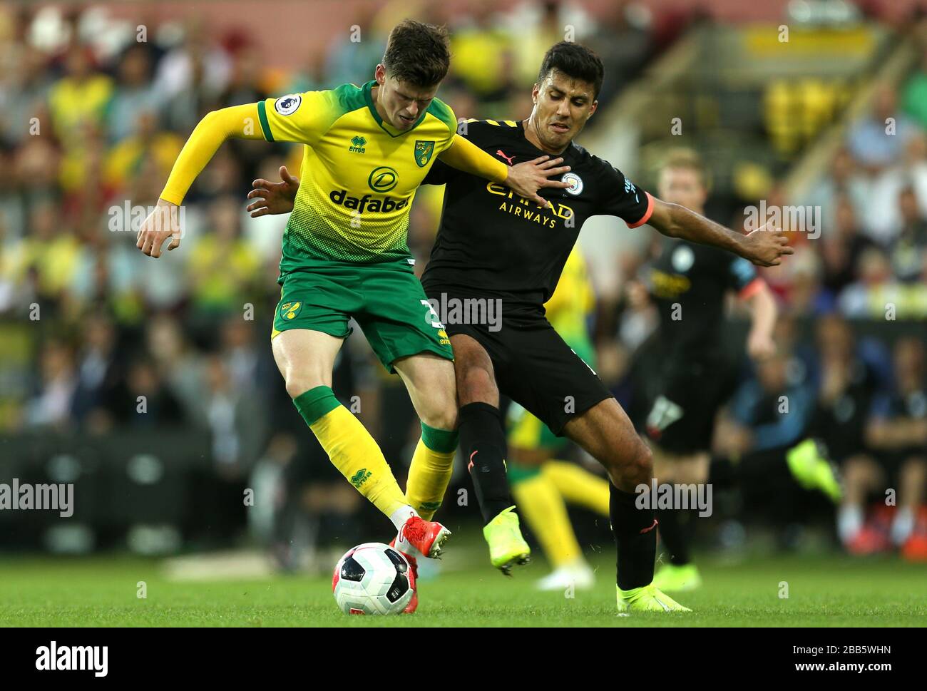 Norwich City's Sam Byram (left) and Manchester City's Rodrigo battle ...