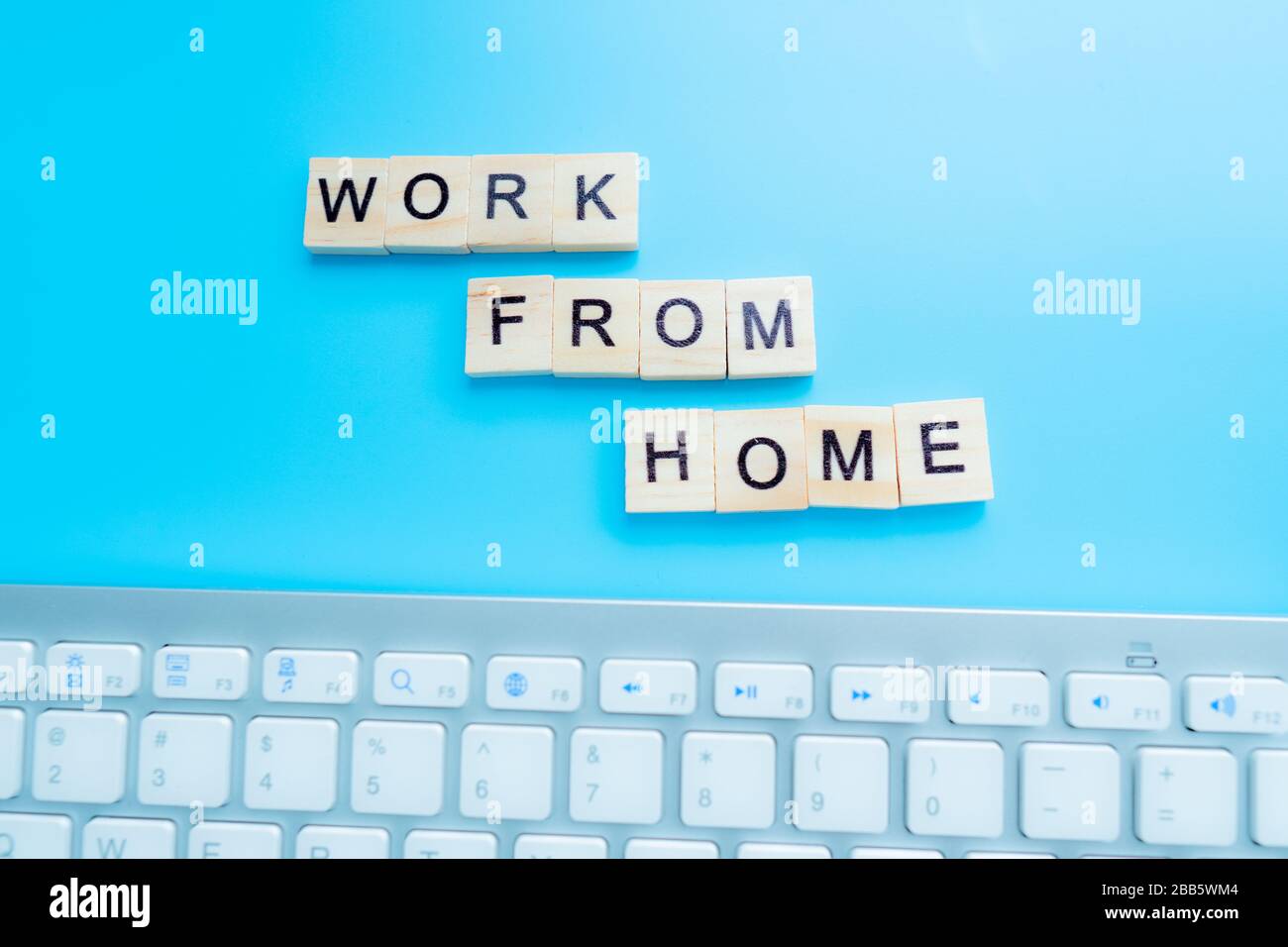 Work From Home, message concept written post it on laptop keyboard ...