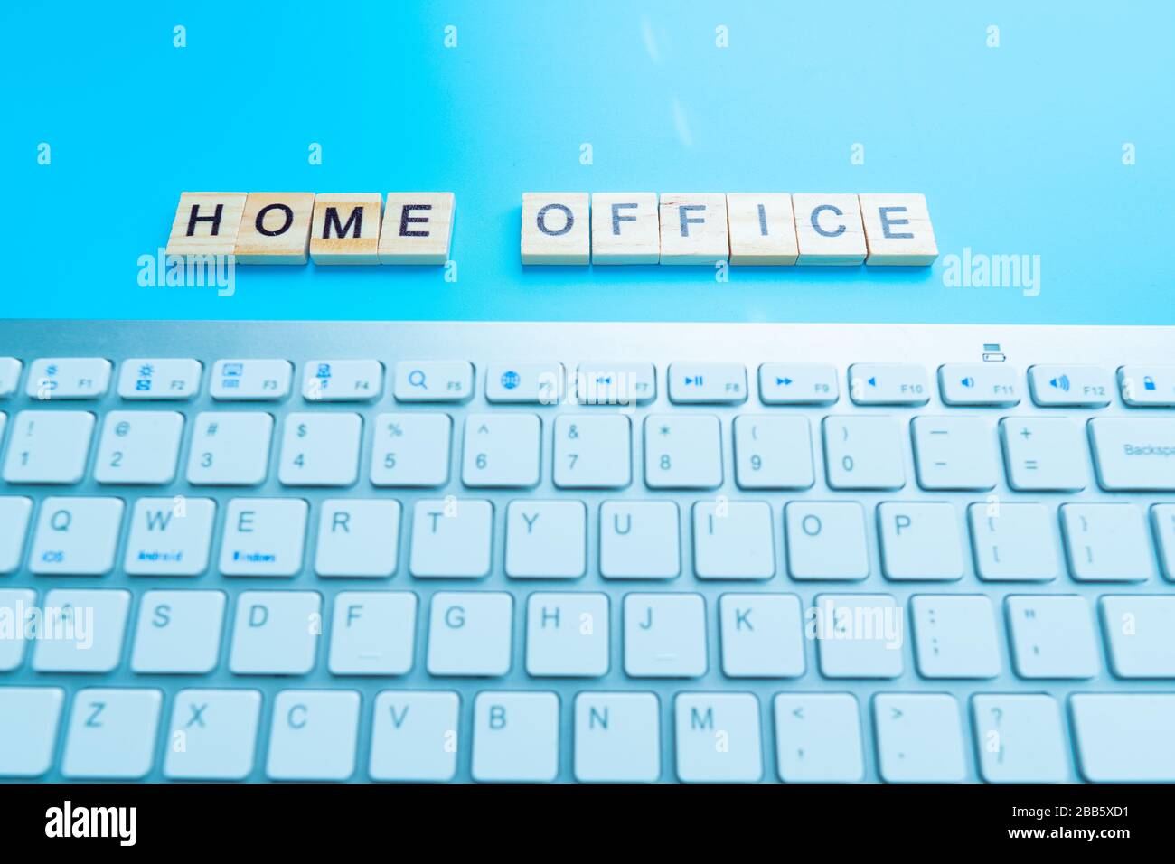 home office work from home concept with letters wooden. And keyboard ...