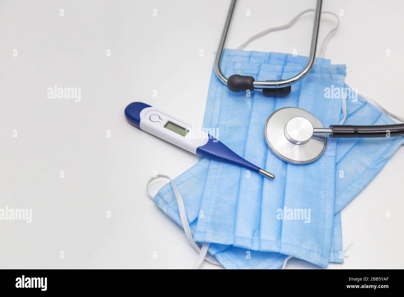Novel coronavirus COVID-19 - protective medical masks,Stethoscope and thermometer. Chinese ...