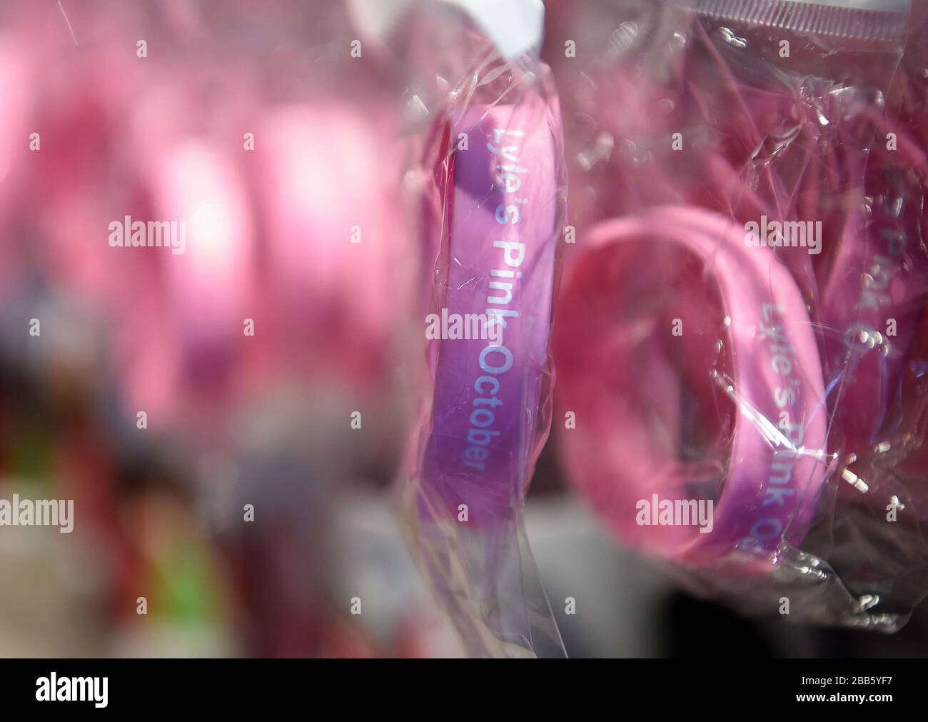 Pink wristbands for Cancer Research UK Stock Photo - Alamy