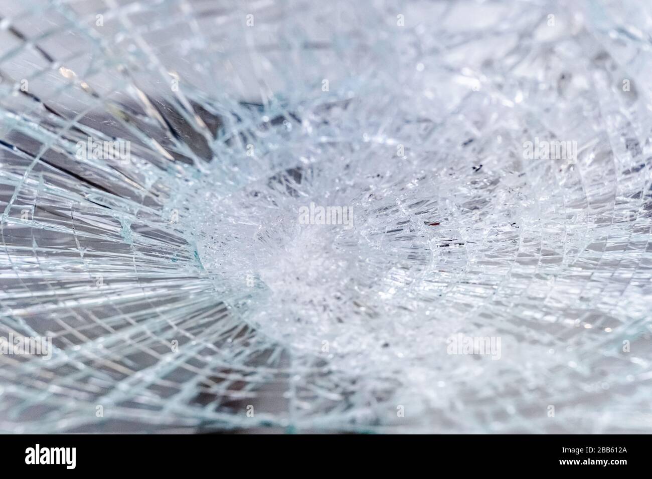 Detail of a broken glass of a window Stock Photo - Alamy