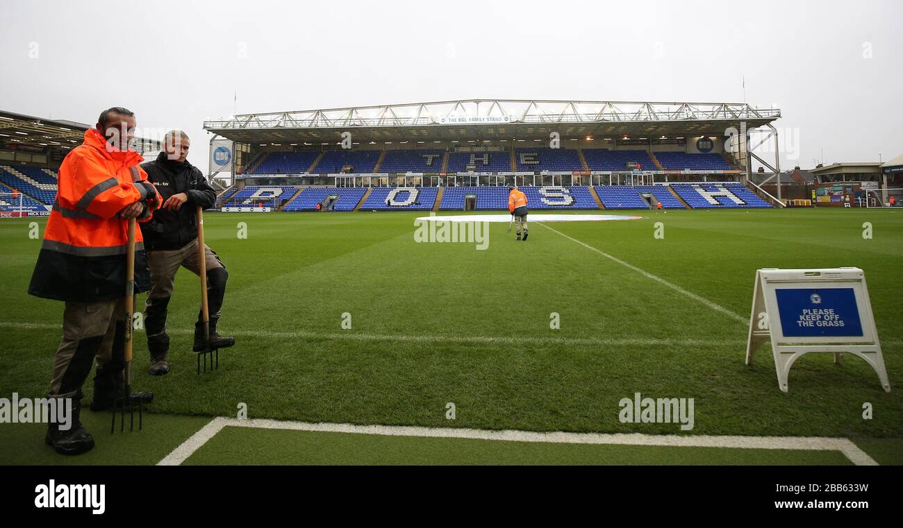 A general view of ground staff inside the Weston Homes Stadium before ...