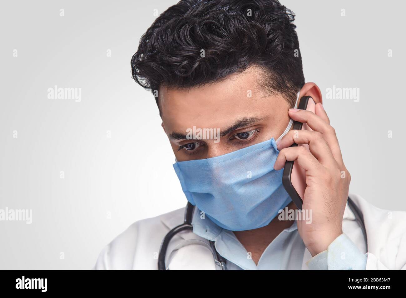 Indian man sad talking on phone hi-res stock photography and images - Alamy