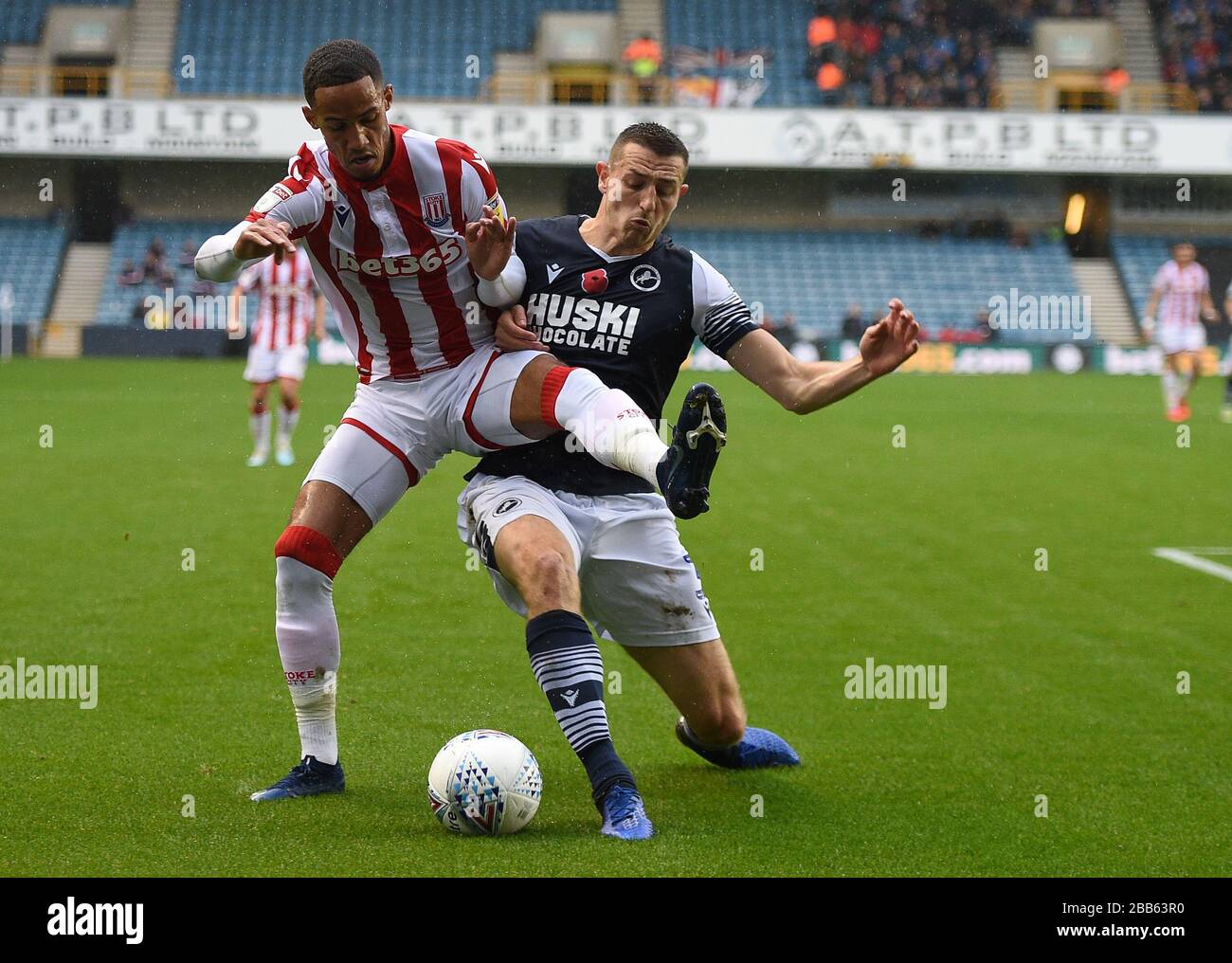 Stoke City's Tom Ince and Millwall's Murray Wallace battle for the ball ...