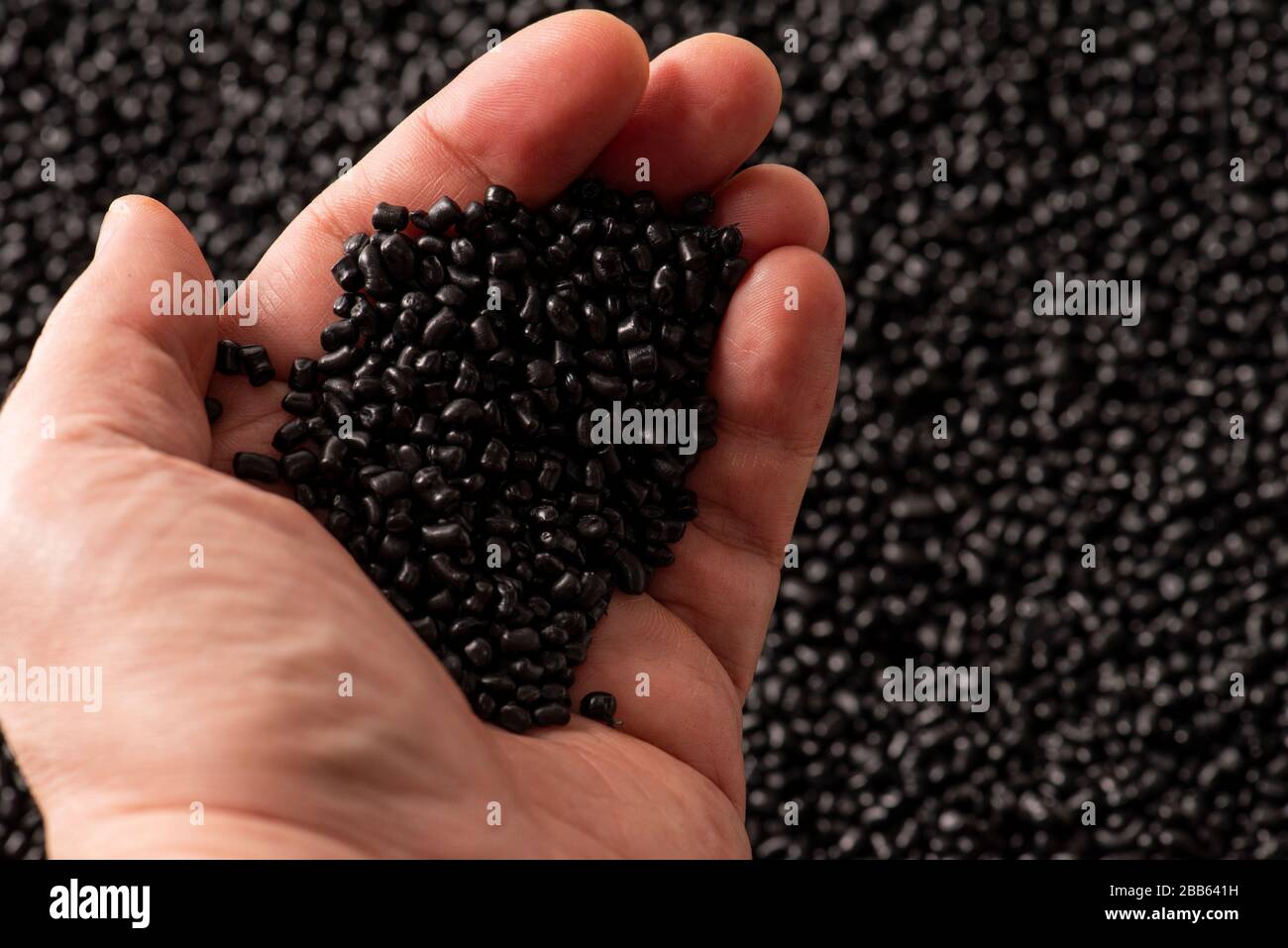 Hand in black resin hi-res stock photography and images - Alamy