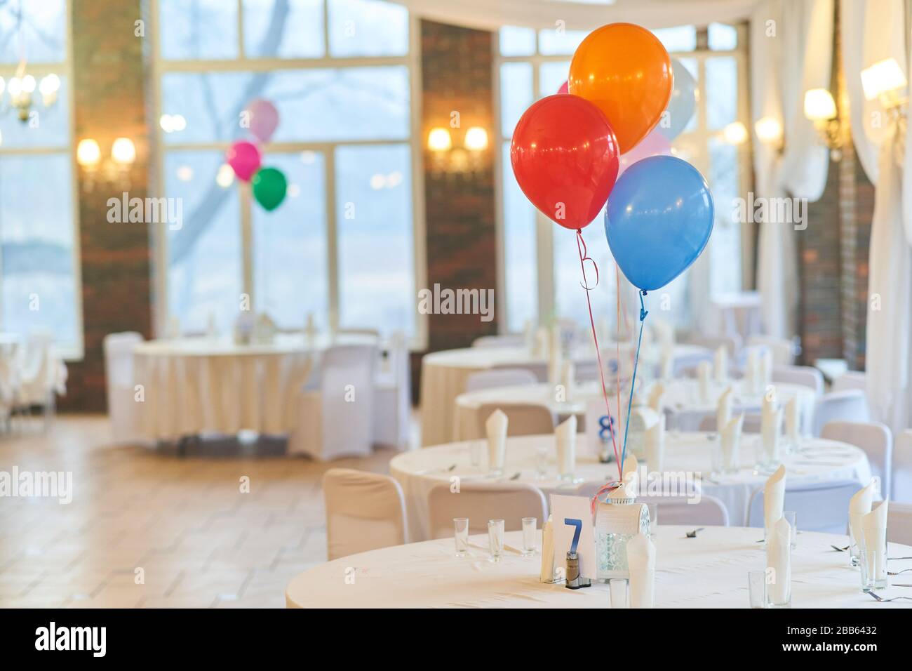 Three multi-colored balloons on holiday. Close-up balloons at an event ...