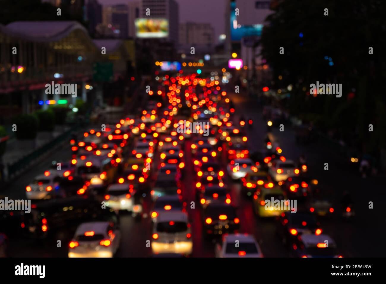 Blurred footage. Traffic jam on a wide street. Blurry brake lights ...