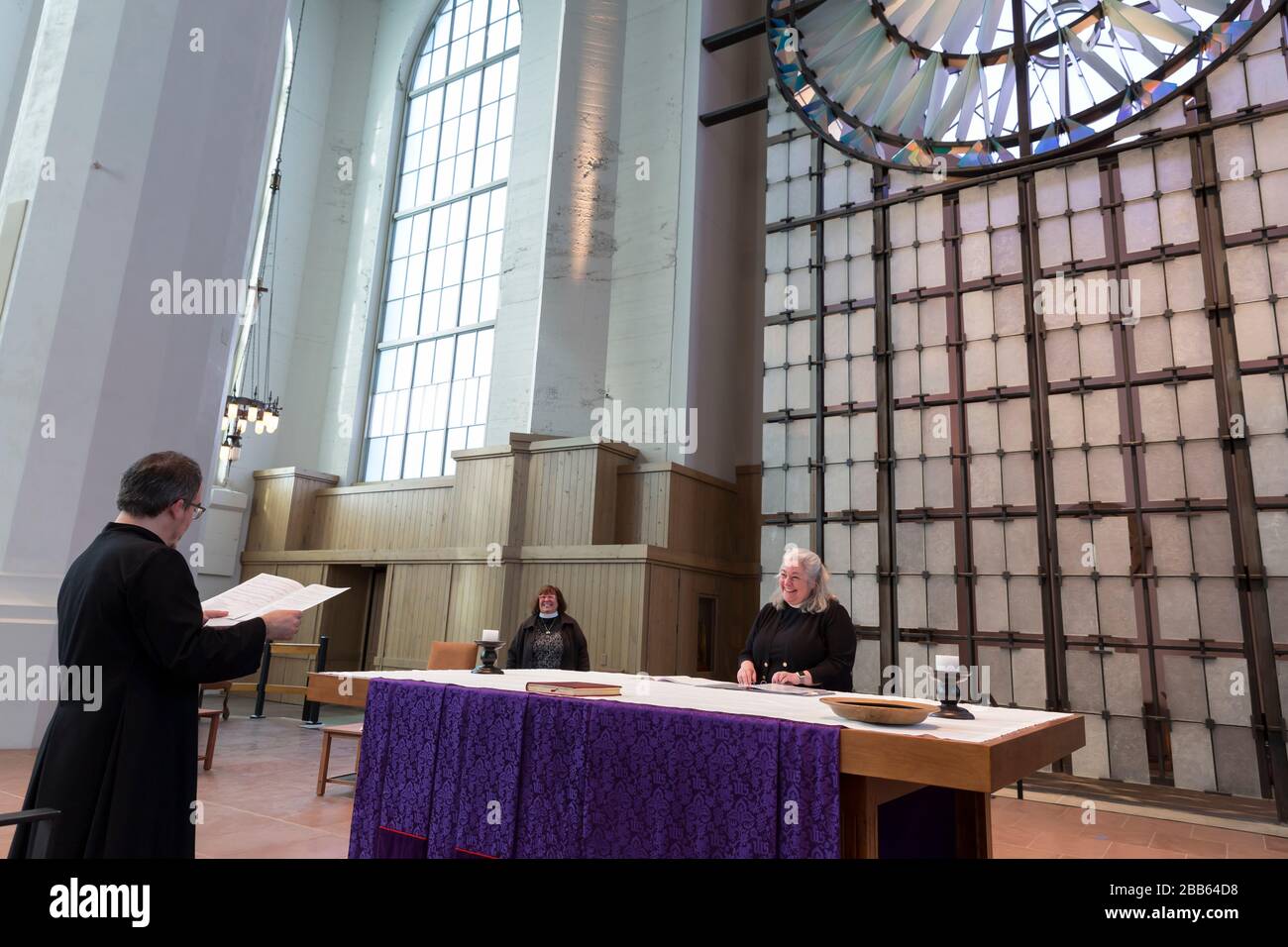 Sacristan Michael Seewer prepares for a livestream-only service of Holy ...