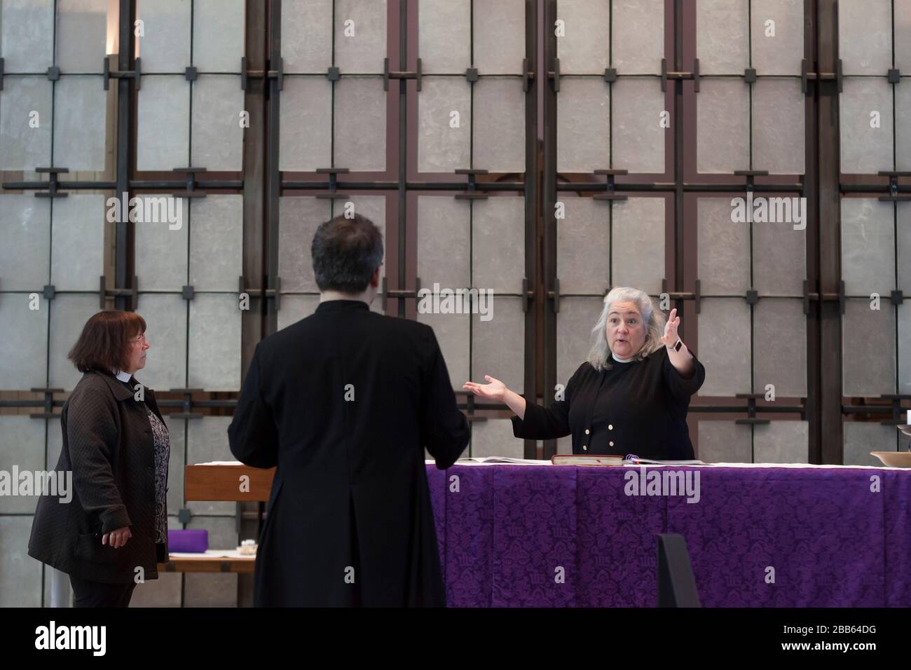 The Reverend Jennifer King Daugherty (r) prepares for a livestream-only ...