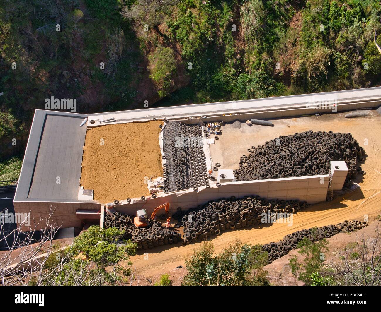 Civil engineering project showing rock shed construction using large ...