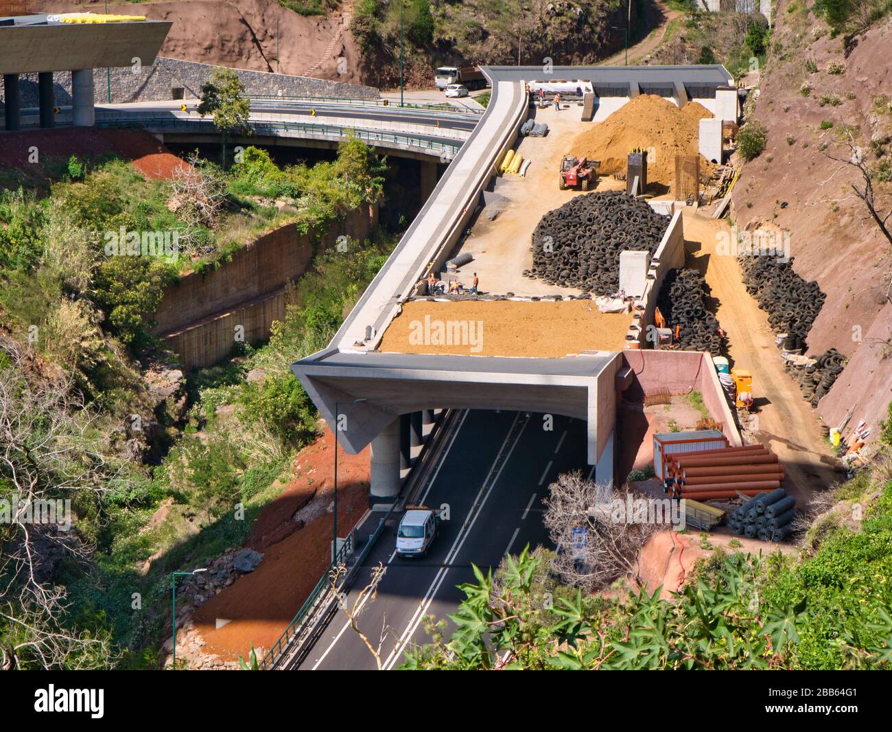 Civil engineering project showing rock shed construction using large ...