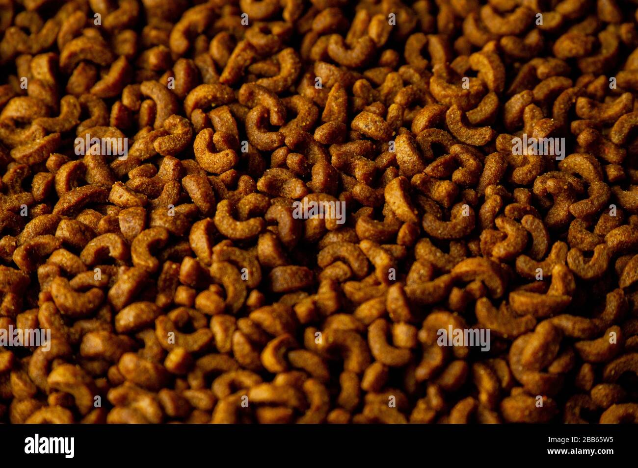 Dried dog food background. Dry food for animals. Food for cats or dogs ...