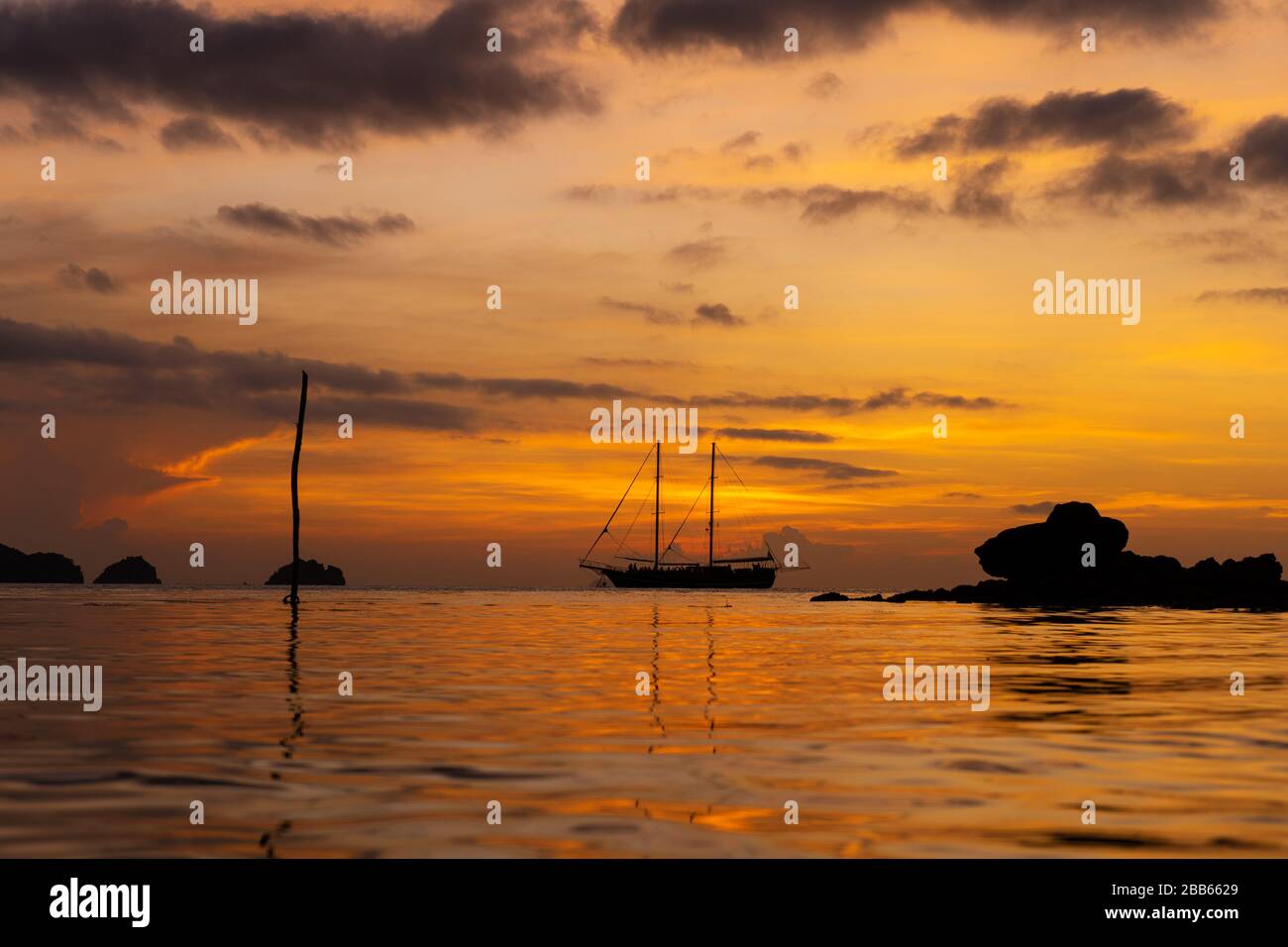 Colorful sunset on a tropical beach. Orange sunset on the ocean ...