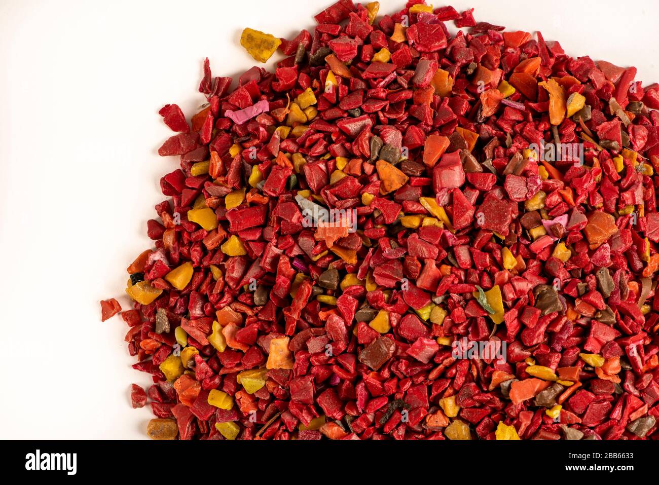 Granular recycled plastic on white background Stock Photo - Alamy