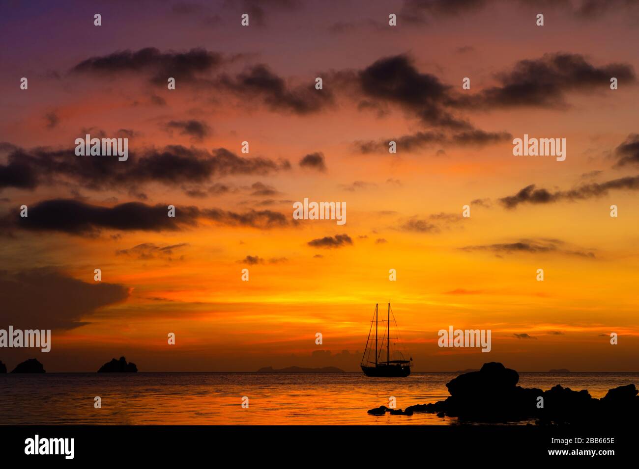 Colorful sunset on a tropical beach. Orange sunset on the ocean ...