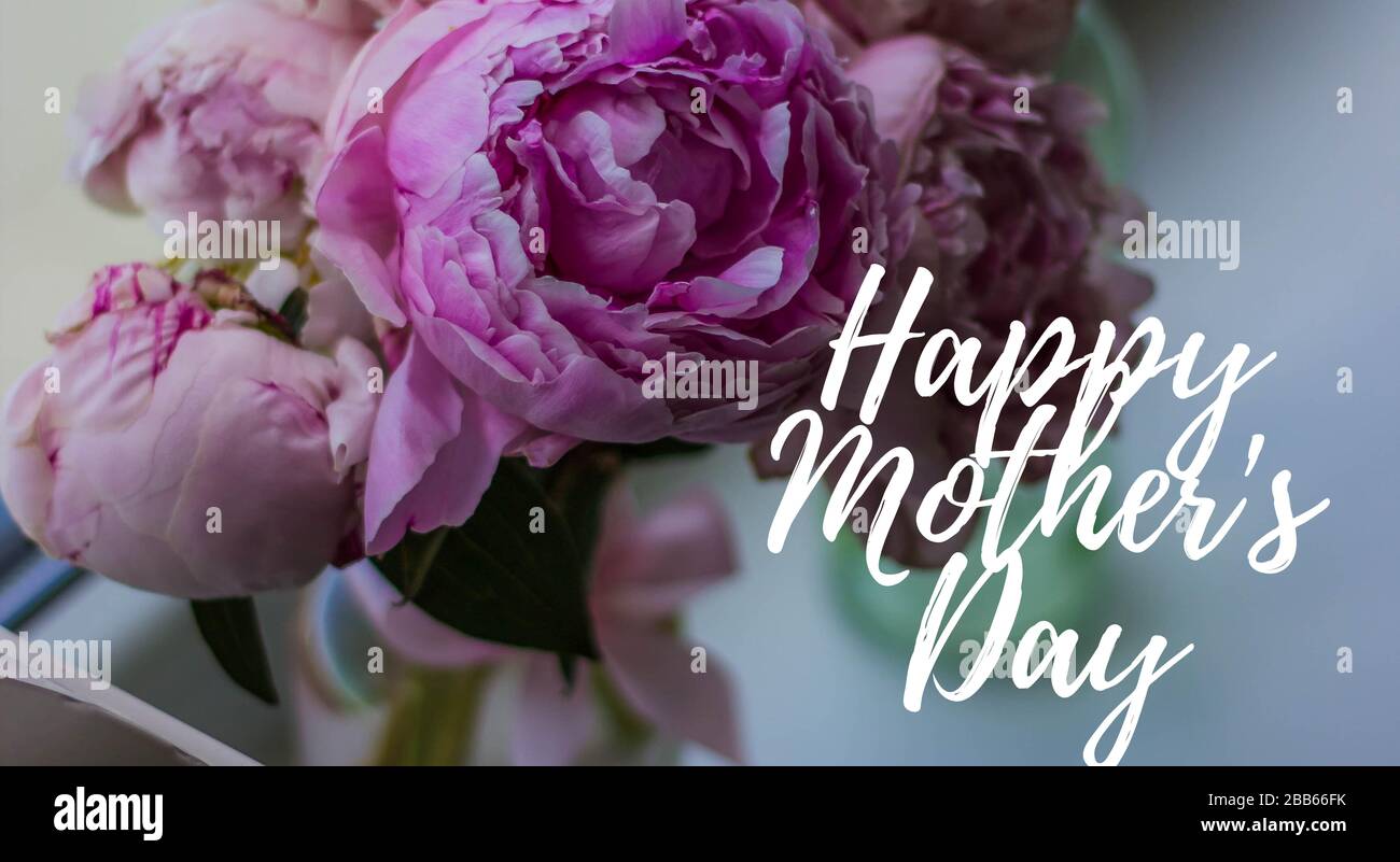 Happy Mothers Day words. Beautiful and tender bouquet of flowers in the ...