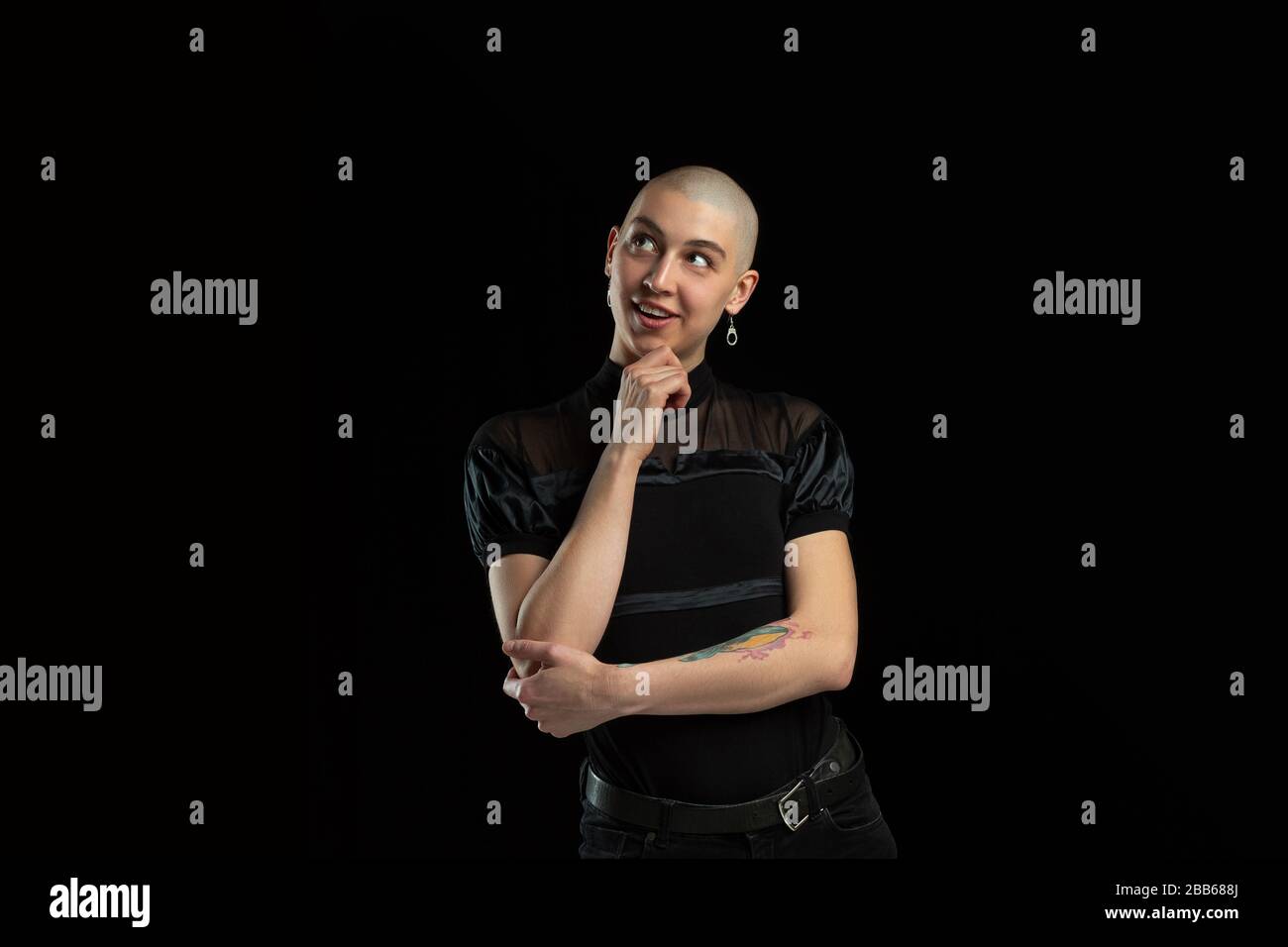Thoughtful, dreamful. Monochrome portrait of young caucasian bald woman ...