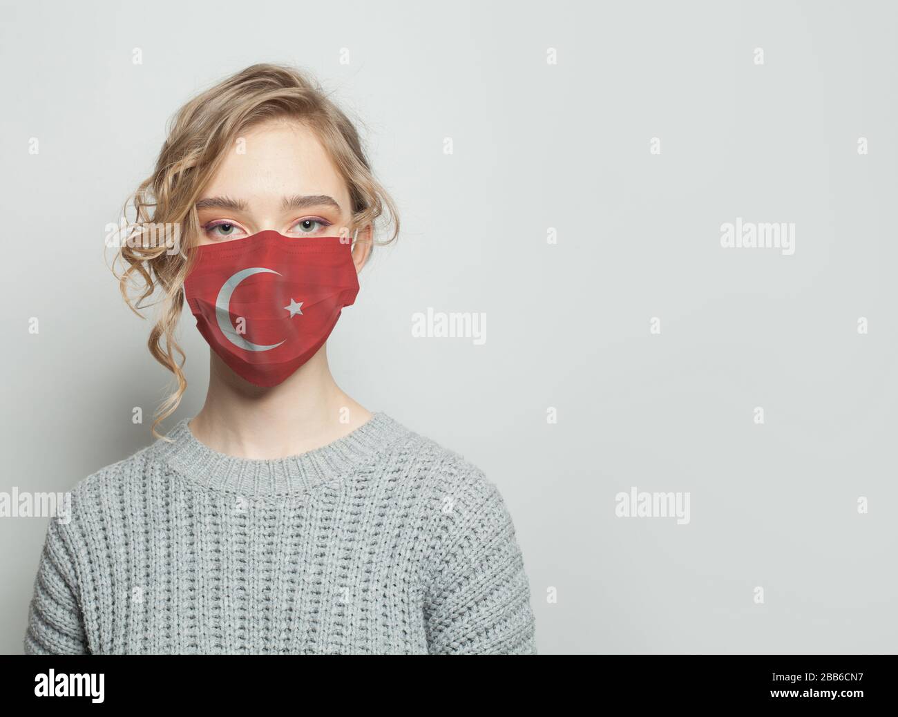Virus protection in Turkey concept. Young woman wearing a face mask ...