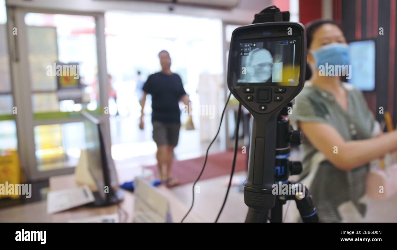 Temperature check at a supermarket, grocery store with a thermal ...