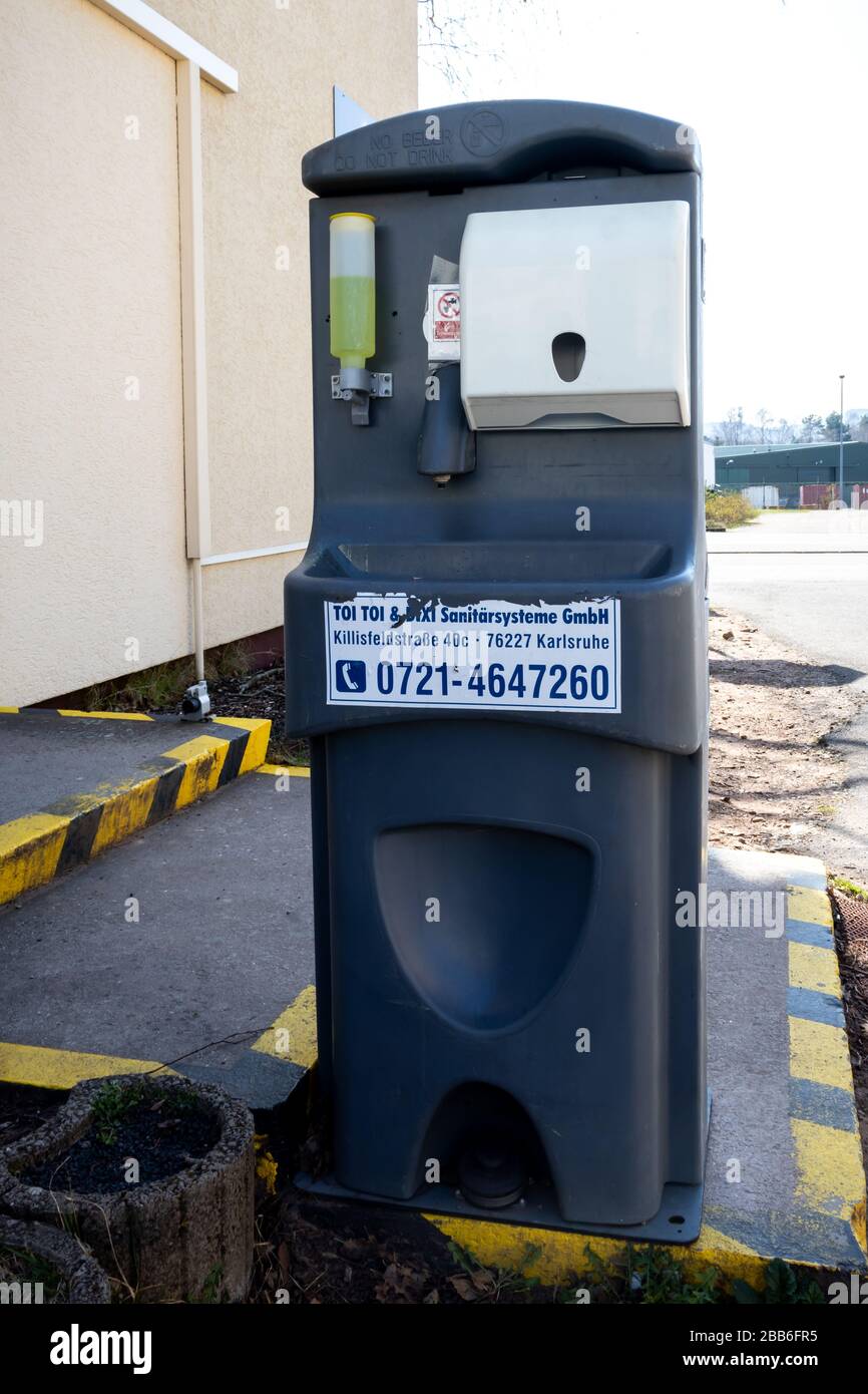 Portable hand washing station set up outside a store in Germany to help ...