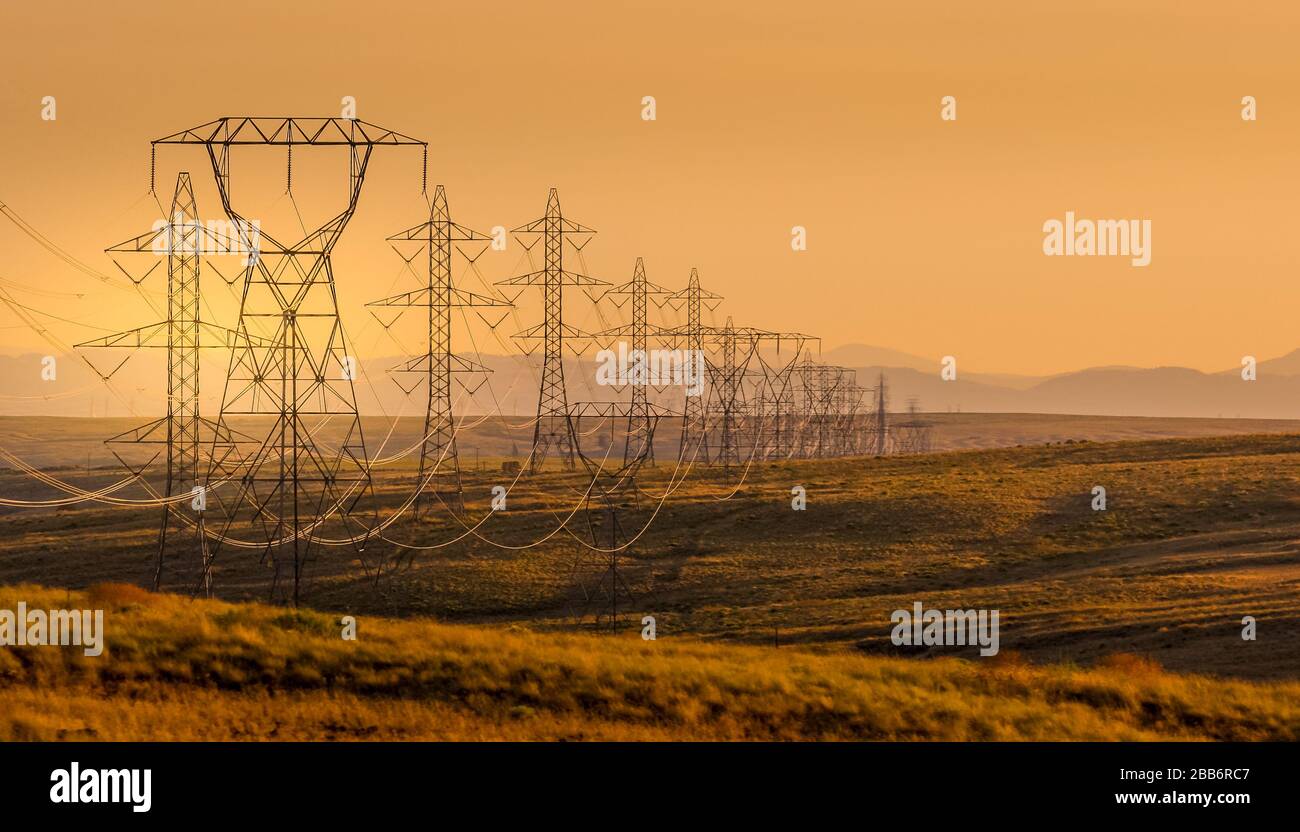 Electrical power lines through a rural landscape at sunset, USA Stock ...