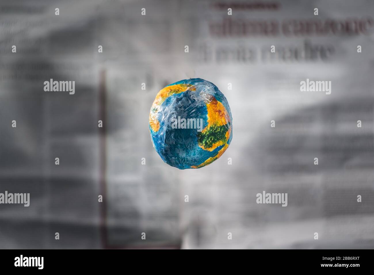 The concept of the world press. focus is the layout of the planet Earth ...