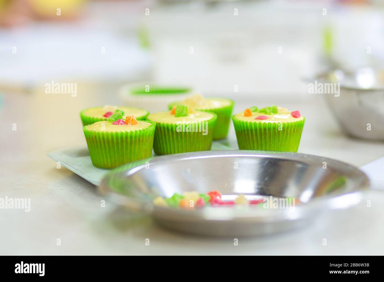 The process of making cupcakes. Creation of cakes by professional ...