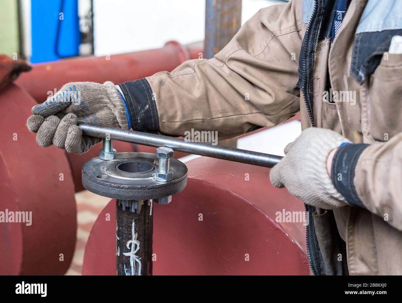 Fitter assembler is assembling a new gas pipeline line in a gas boiler ...