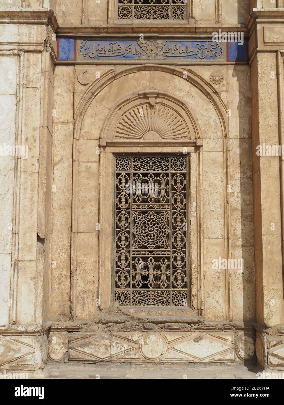 a traditional arabic decorated window with ornaments outside a mosque ...