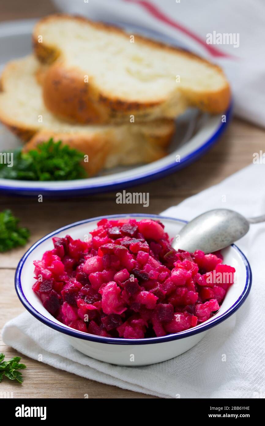 Traditional Russian lean vegetable salad vinaigrette in an iron bowl ...
