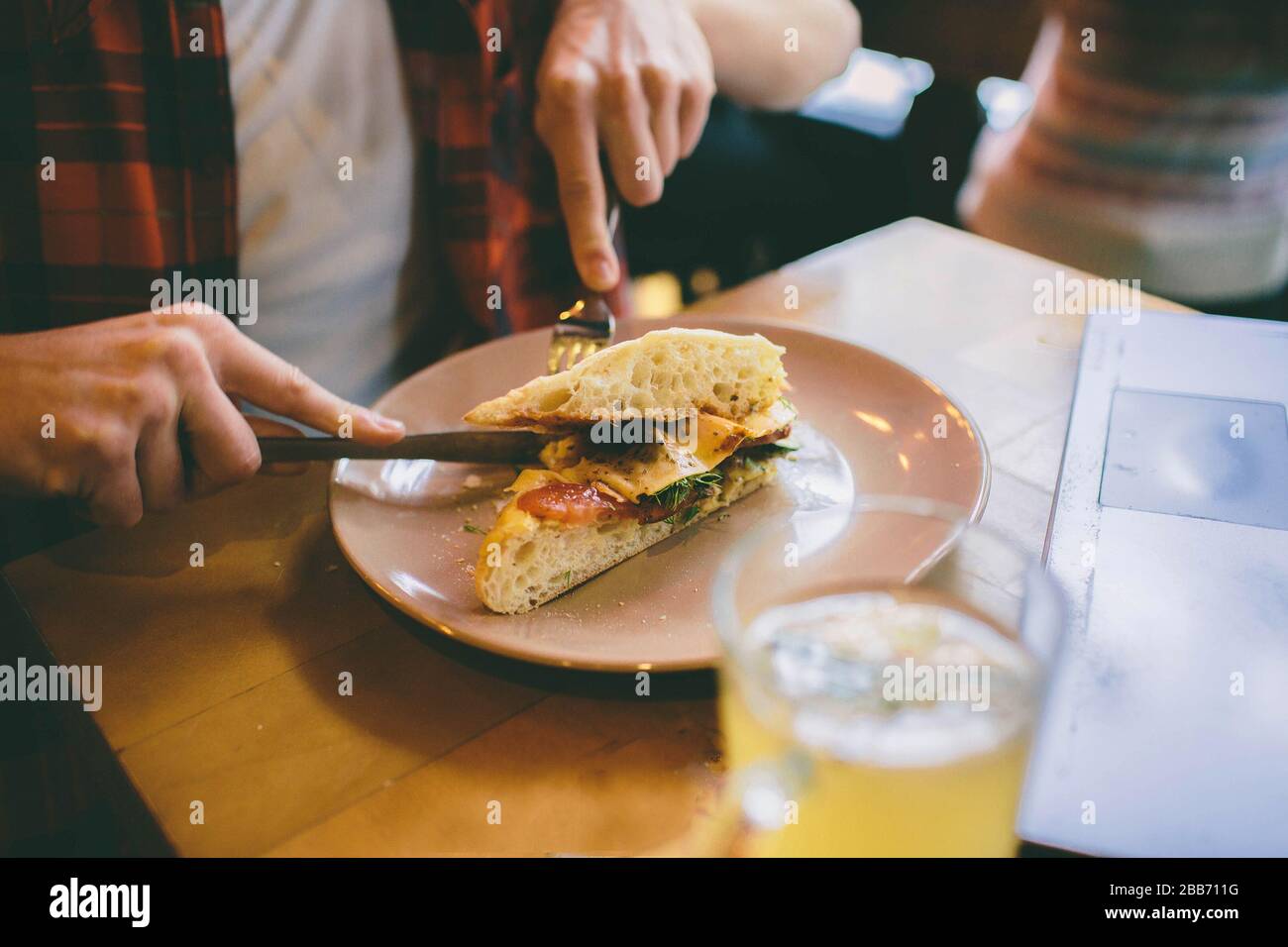 Man is eating in a restaurant and enjoying delicious food Stock Photo ...